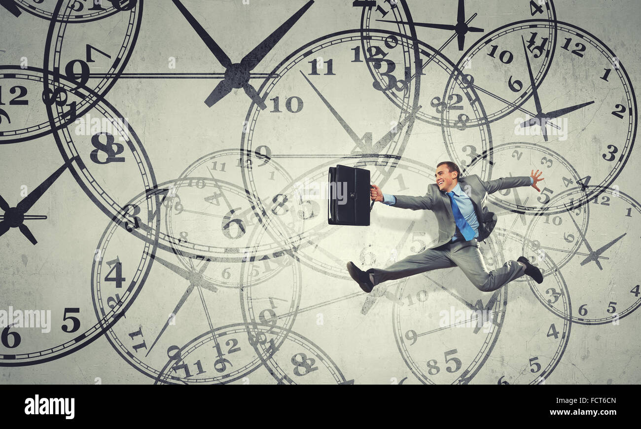 Concept of time with funny businessman running in a hurry Stock Photo ...