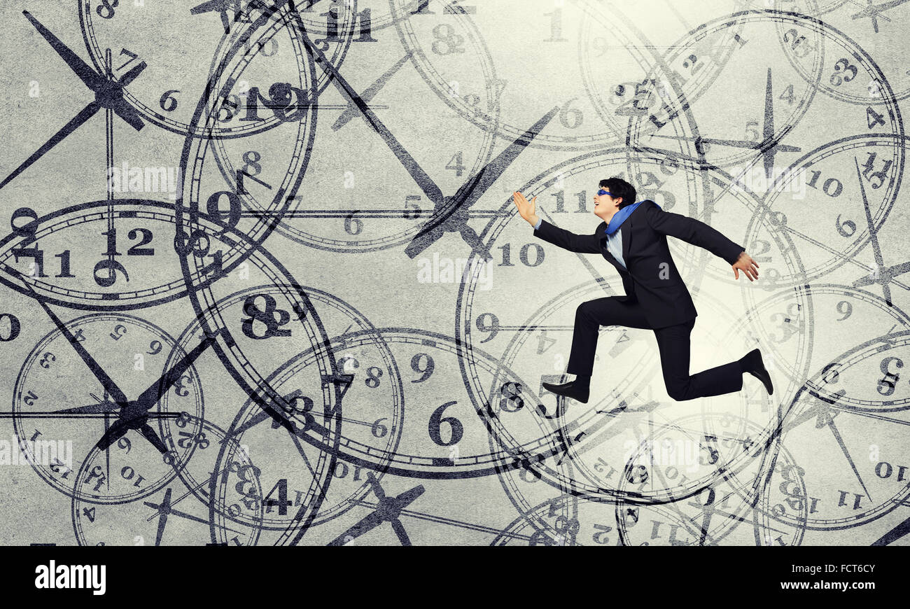Concept of time with funny businessman running in a hurry Stock Photo ...