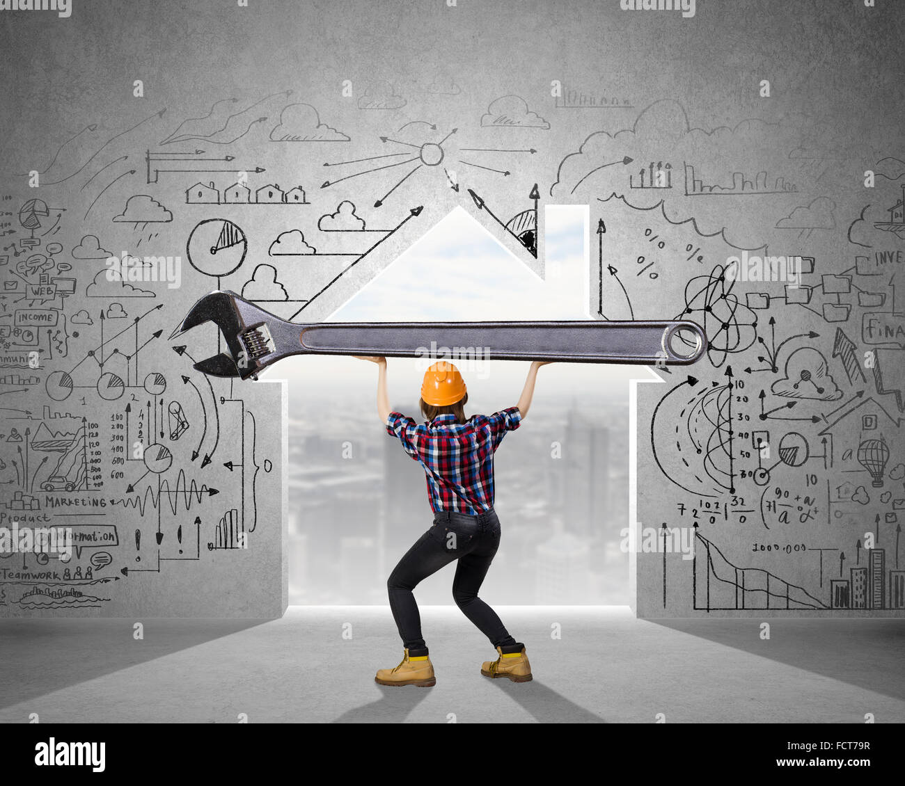 Young engineer woman lifting big wrench key above head Stock Photo - Alamy
