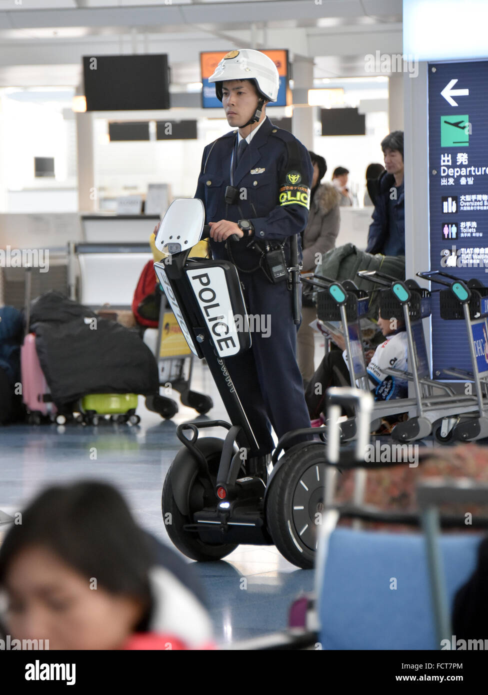 Tokyo, Japan. 25th Jan, 2016. A police officer rides a Segway, a two ...