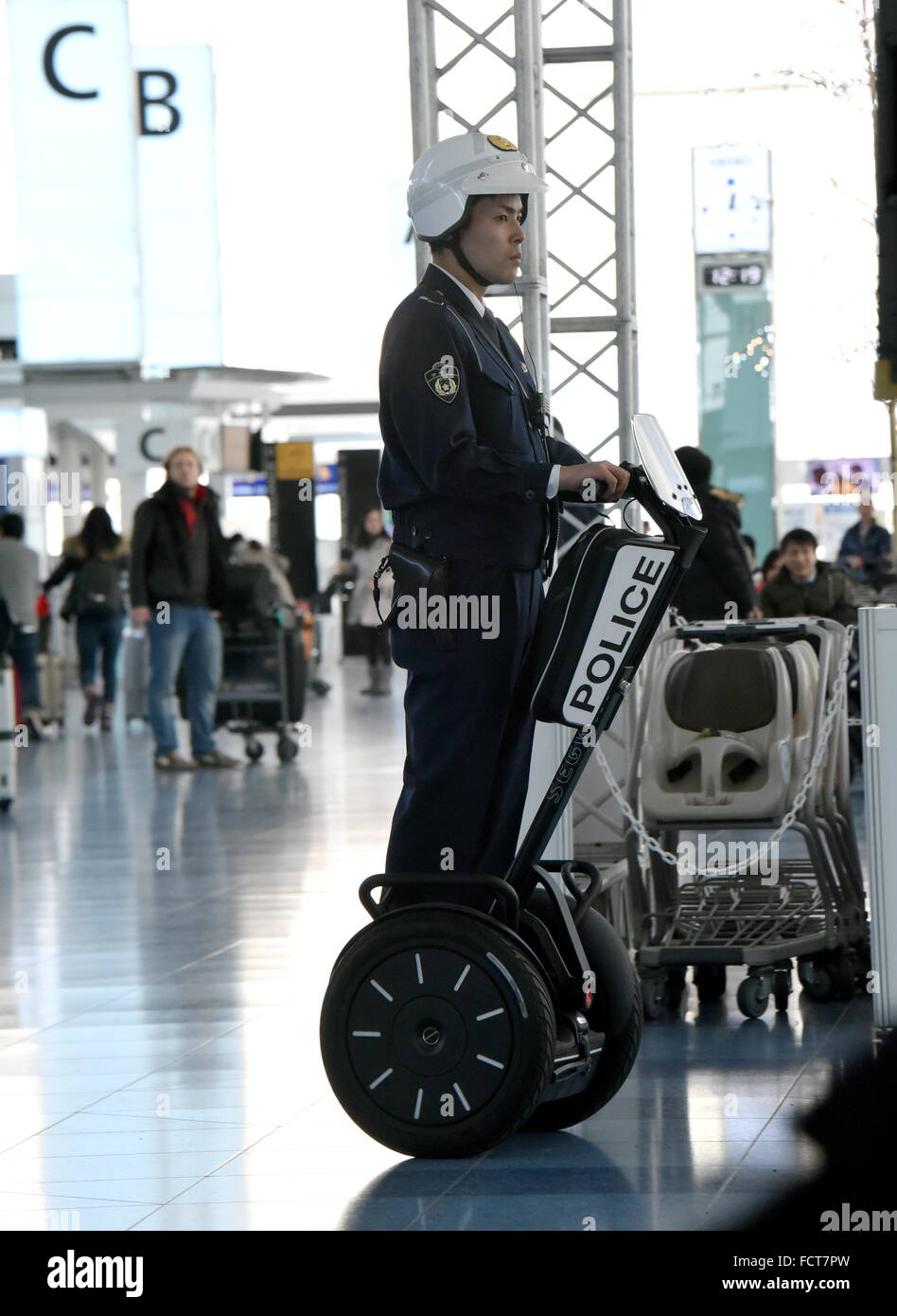 Tokyo, Japan. 25th Jan, 2016. A police officer rides a Segway, a two ...