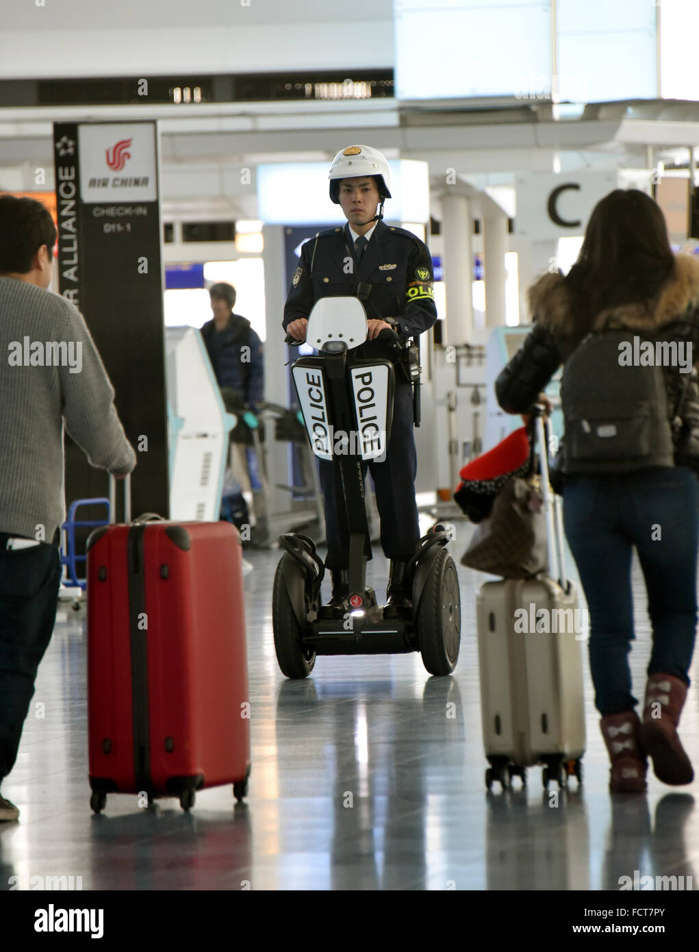 Tokyo, Japan. 25th Jan, 2016. A police officer rides a Segway, a two ...
