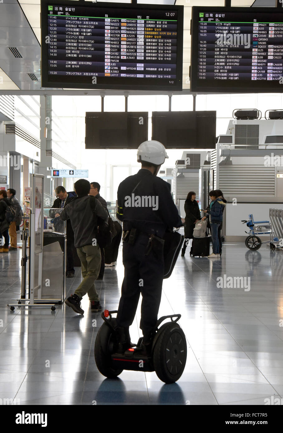Tokyo, Japan. 25th Jan, 2016. A police officer rides a Segway, a two ...