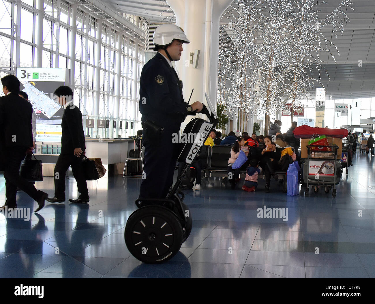 Tokyo, Japan. 25th Jan, 2016. A police officer rides a Segway, a two ...