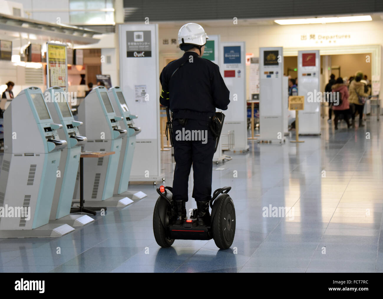 Tokyo, Japan. 25th Jan, 2016. A police officer rides a Segway, a two ...