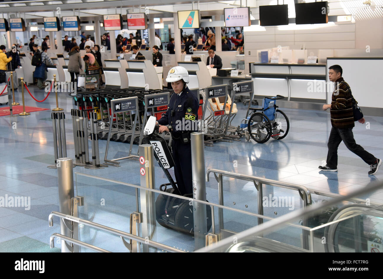 Tokyo, Japan. 25th Jan, 2016. A police officer rides a Segway, a two ...