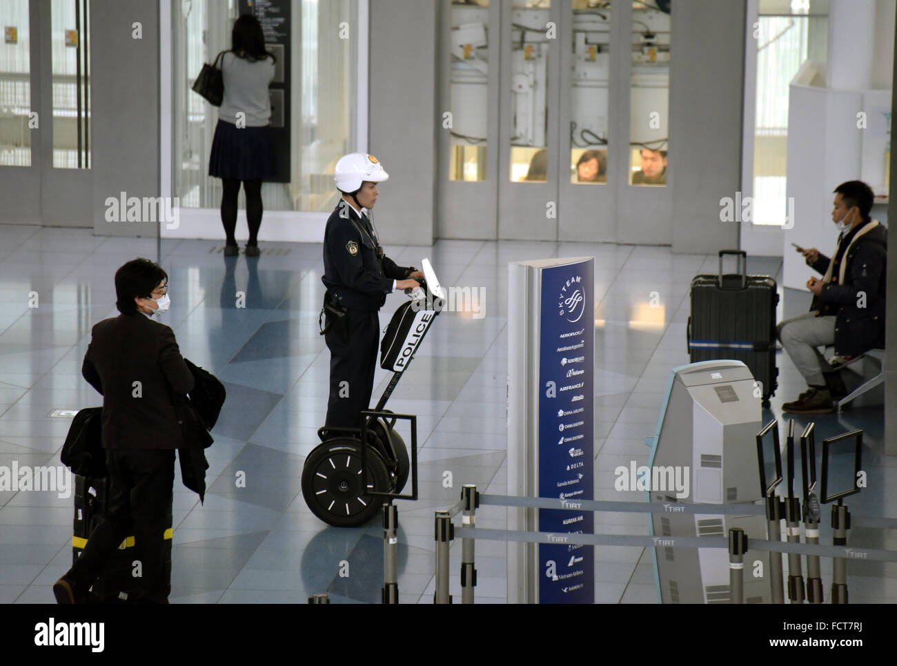 Tokyo, Japan. 25th Jan, 2016. A police officer rides a Segway, a two ...