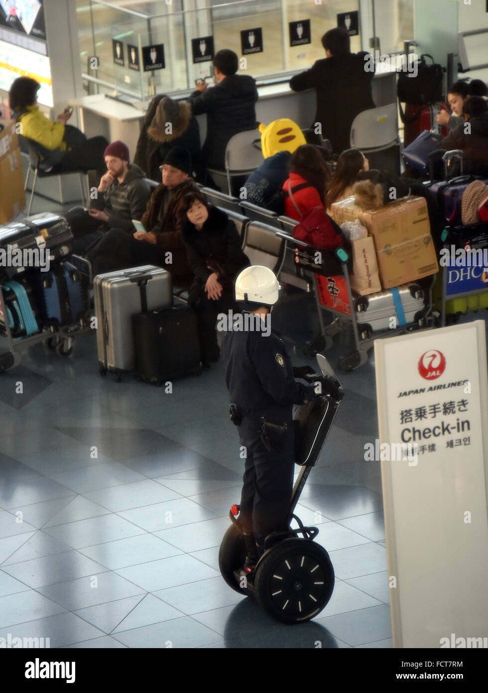 Tokyo, Japan. 25th Jan, 2016. A police officer rides a Segway, a two ...