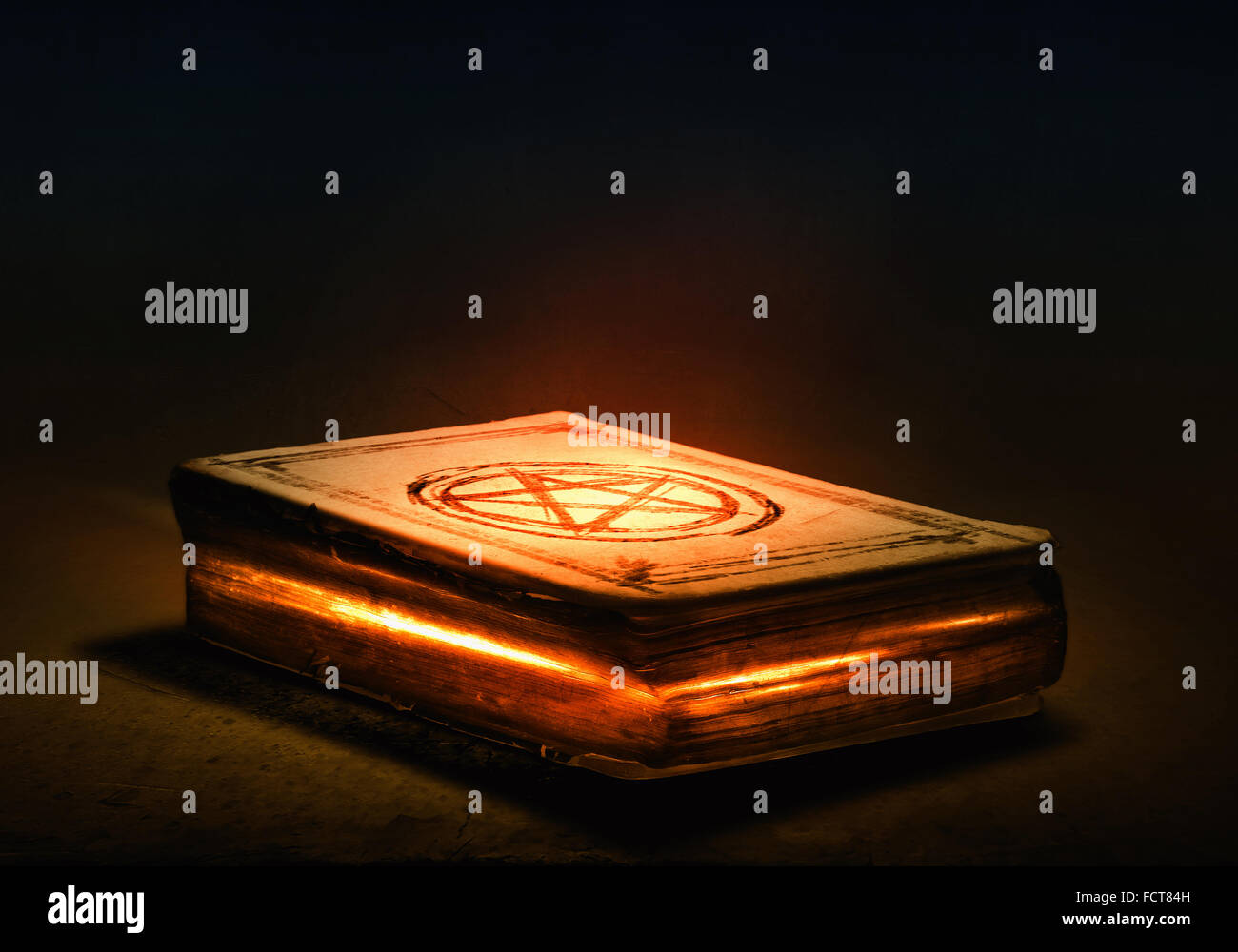 Old black magic book lights hi-res stock photography and images - Alamy