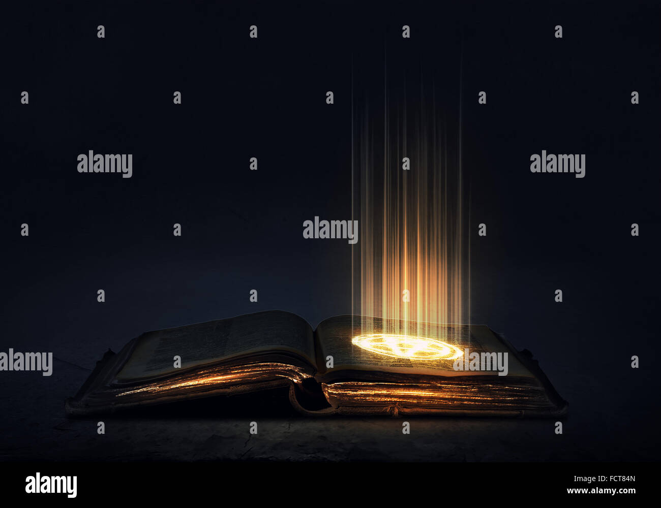 Old black magic book lights hi-res stock photography and images - Alamy