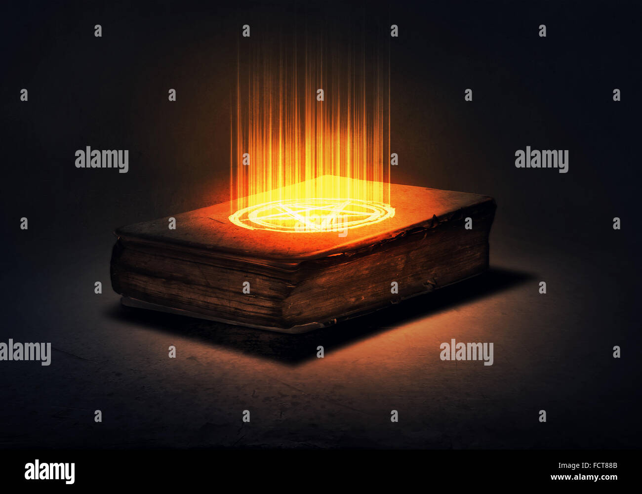 Old black magic book with lights on pages Stock Photo - Alamy