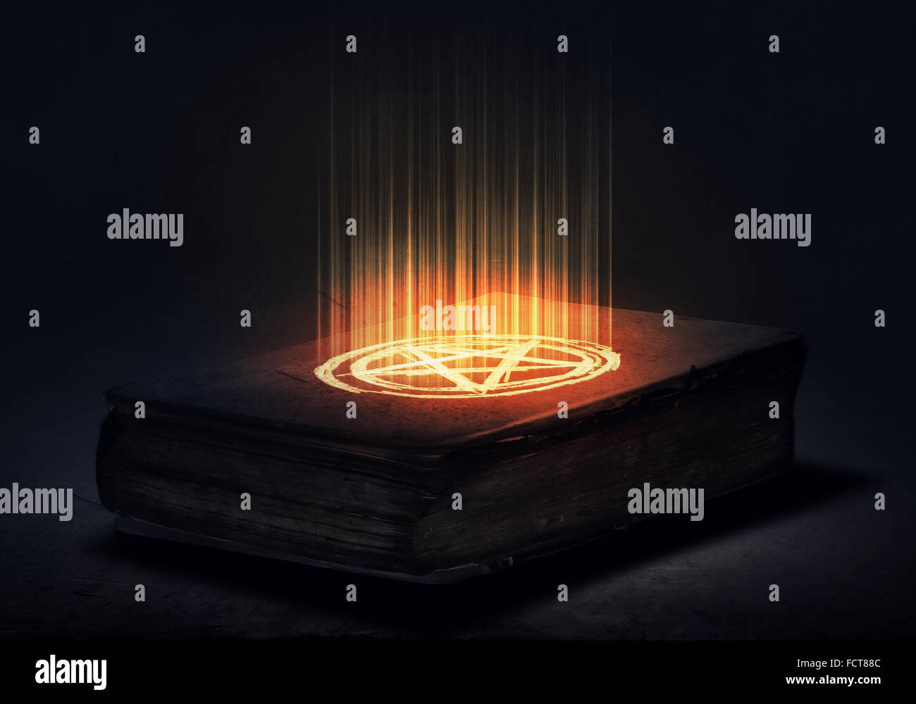 Old black magic book lights hi-res stock photography and images - Alamy
