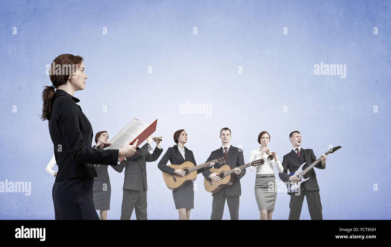Young woman in suit playing different music instruments Stock Photo - Alamy