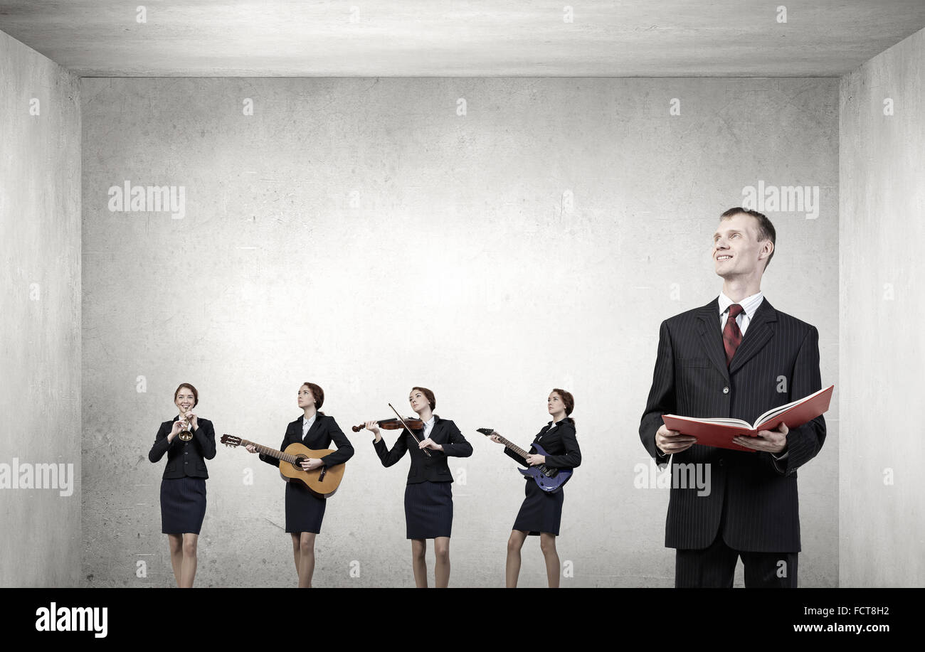Young woman in suit playing different music instruments Stock Photo - Alamy