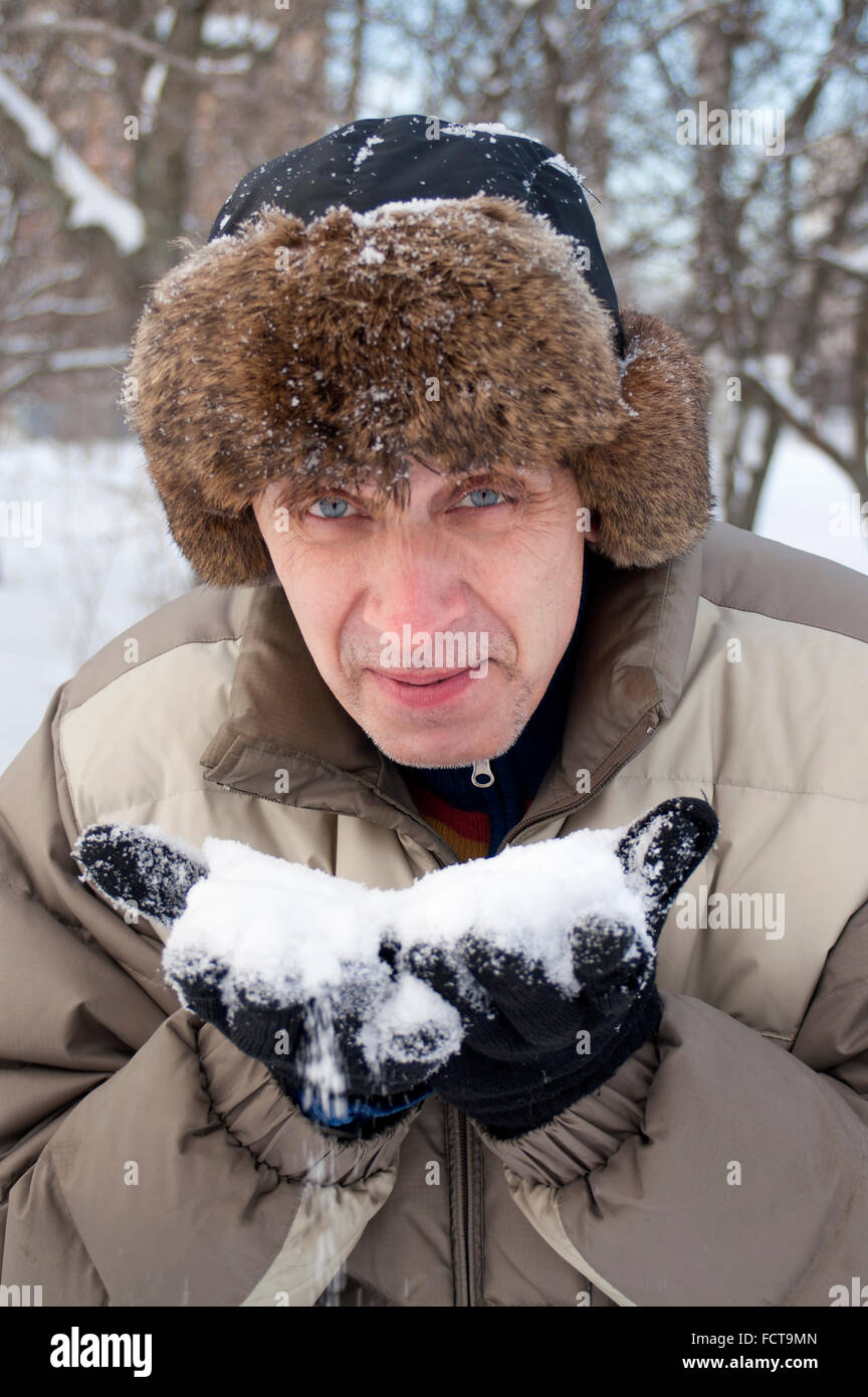 Snow In Hands Stock Photo - Alamy