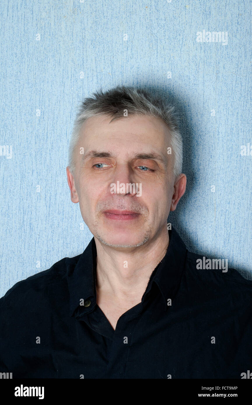 Matured caucasian man with a happy look at his face, cropped studio ...