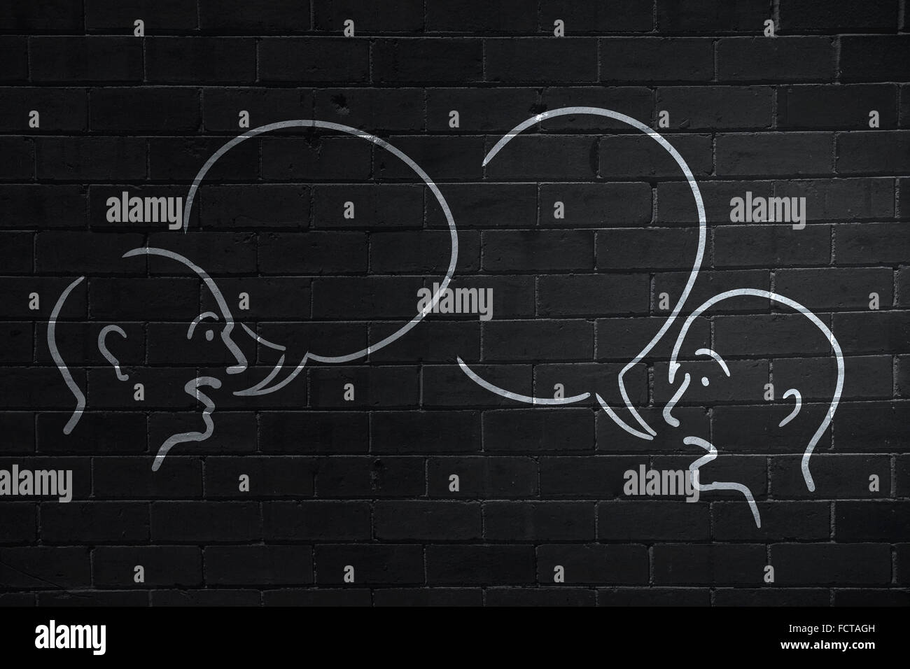 Close up of hand drawing dialogue between two on black wall Stock Photo ...