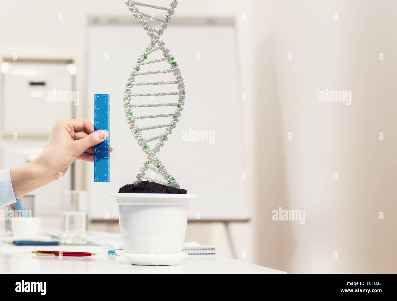 Close up of male hand measuring DNA molecule with ruler Stock Photo - Alamy