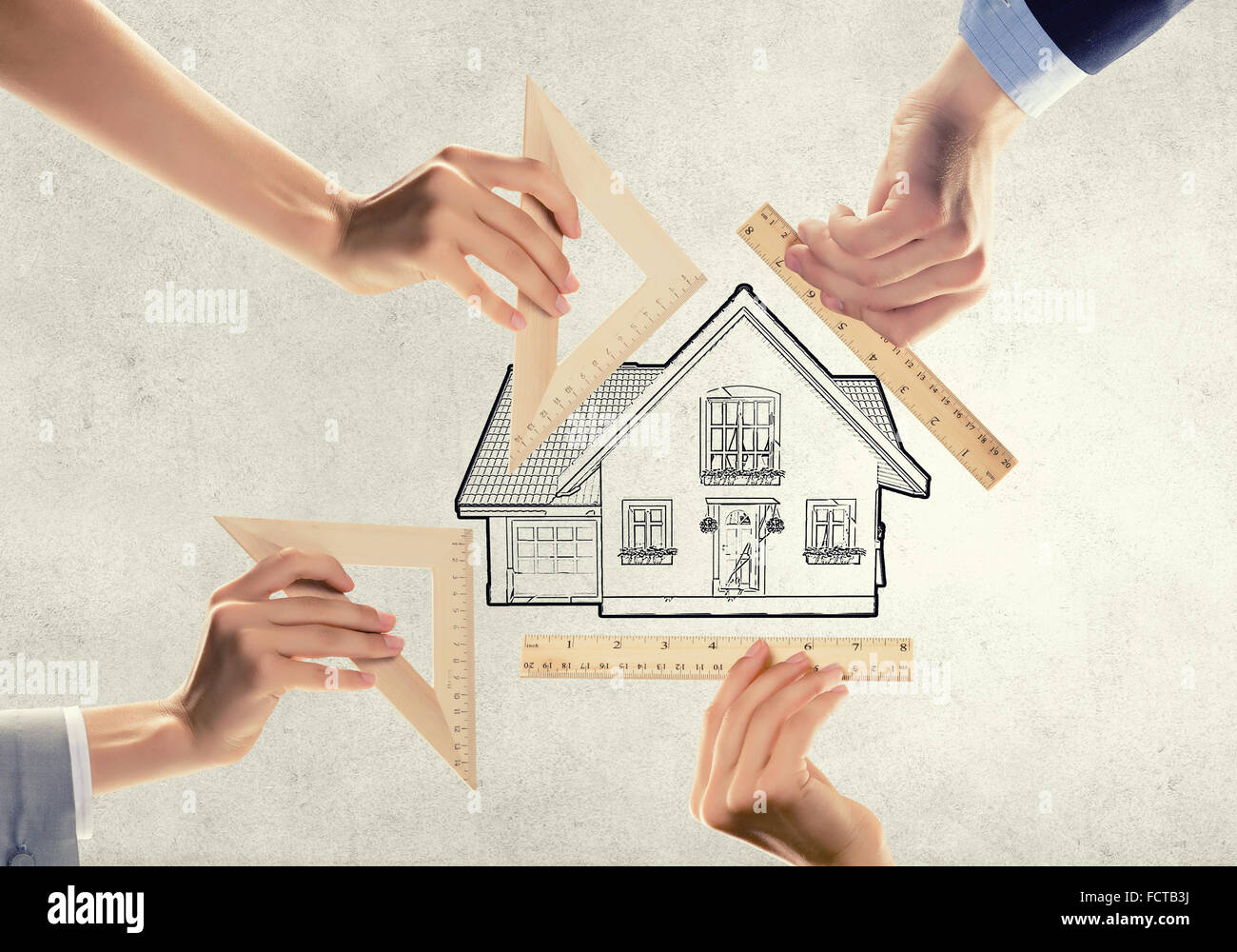 Close up of people hands measuring house model with ruler Stock Photo ...