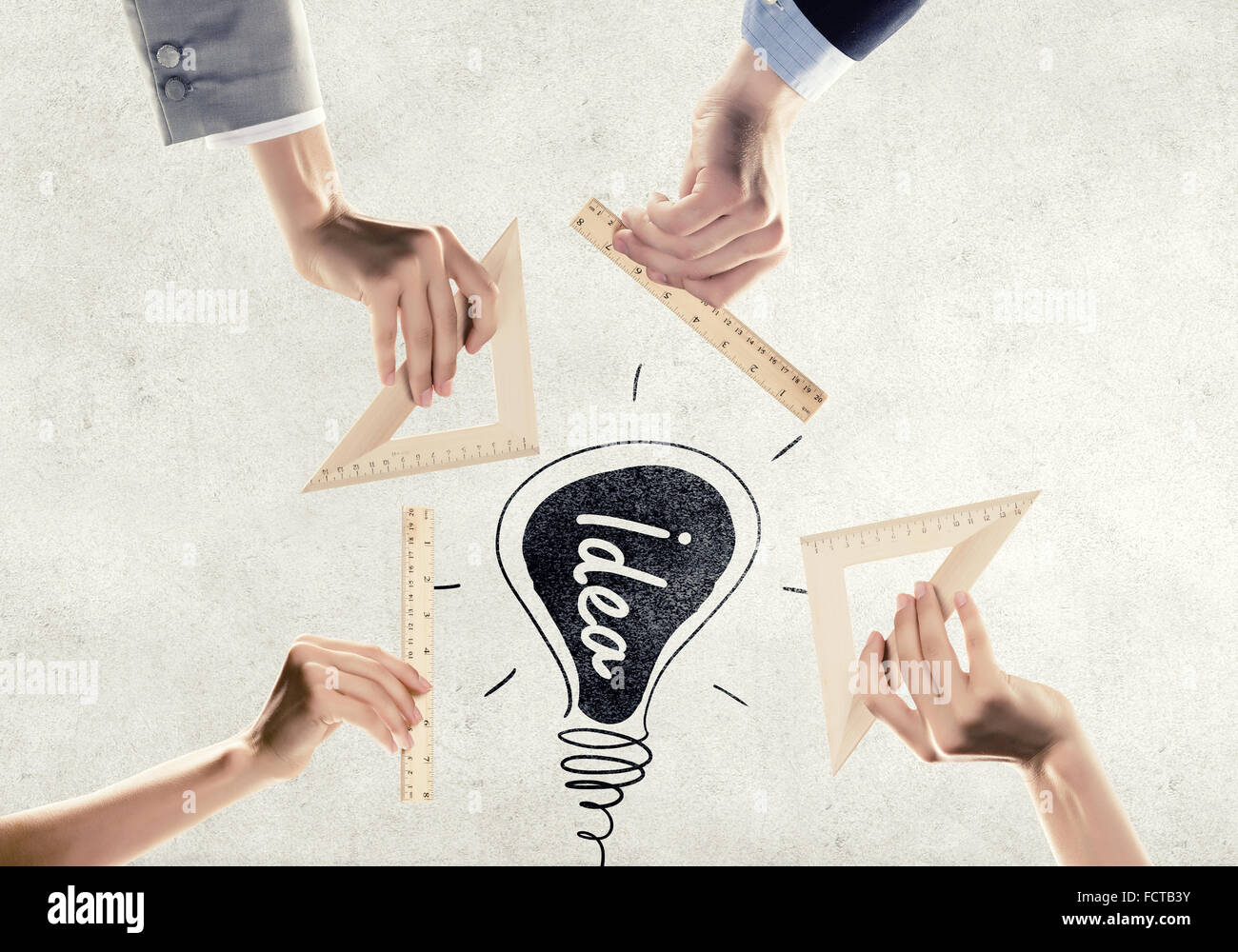 Close up of people hands measuring ight bulb with ruler Stock Photo - Alamy