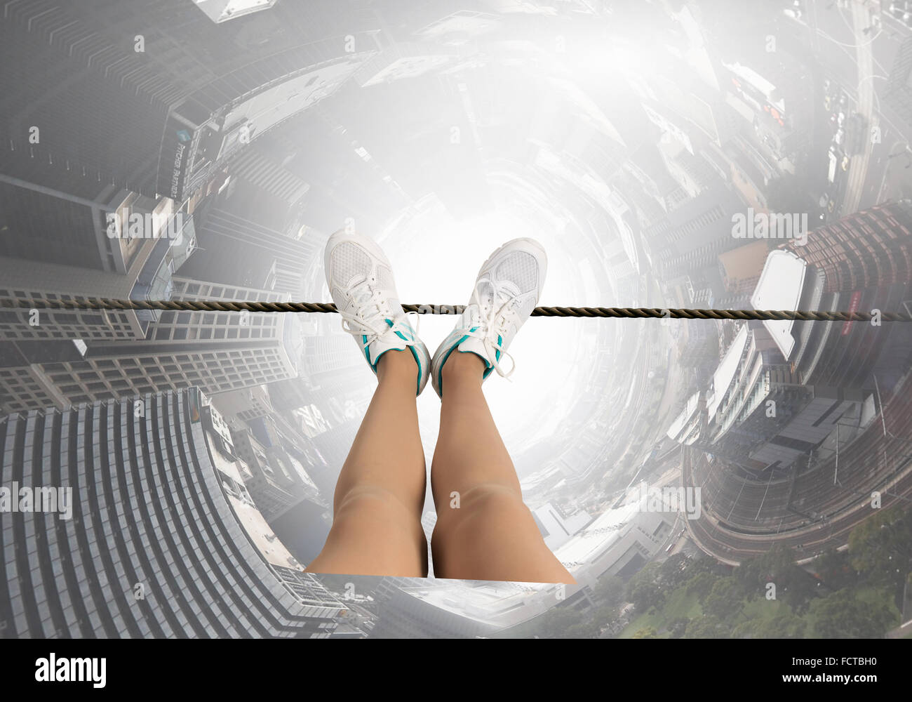 Top view of person standing on rope above city Stock Photo - Alamy