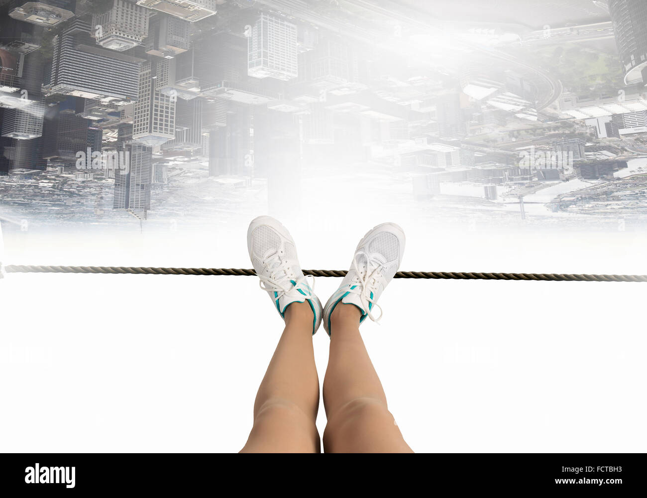 Top view of person standing on rope above city Stock Photo - Alamy