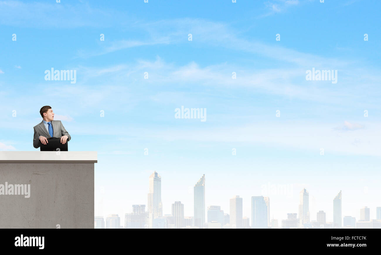 Young handsome businessman with briefcase in hands Stock Photo - Alamy