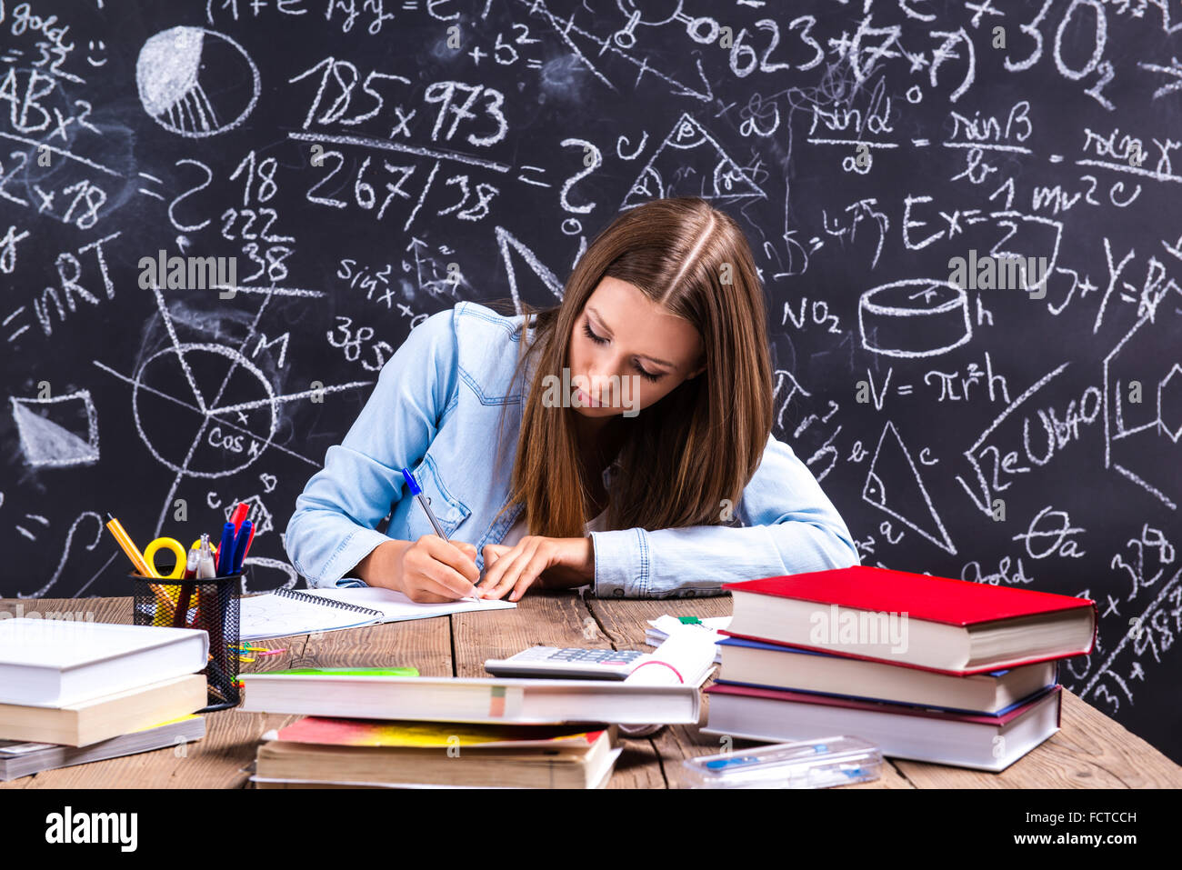 Beautiful student doing homework Stock Photo - Alamy