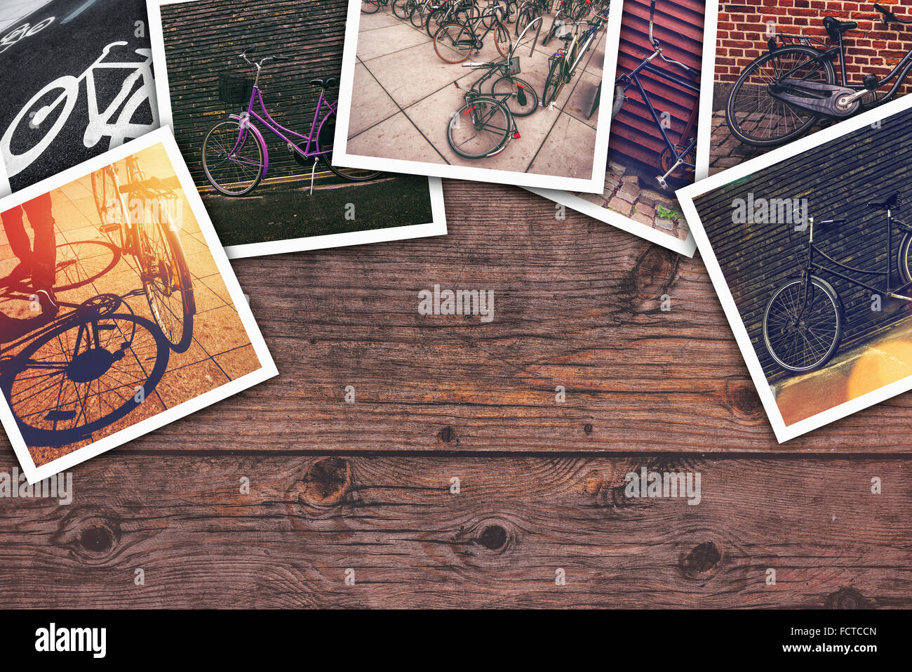 Bicycle pictures collage, stack of bike photos on wooden desk as copy ...
