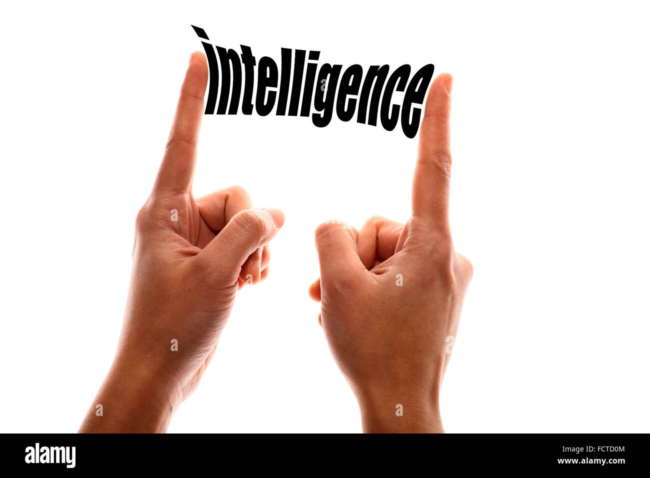 Color horizontal shot of a hand squeezing the word "intelligence Stock ...