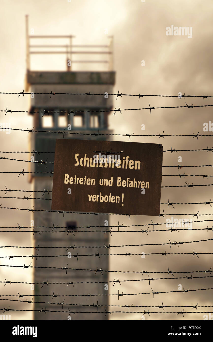 Watchtower with barbed wire and prohibition sign at the former inner ...