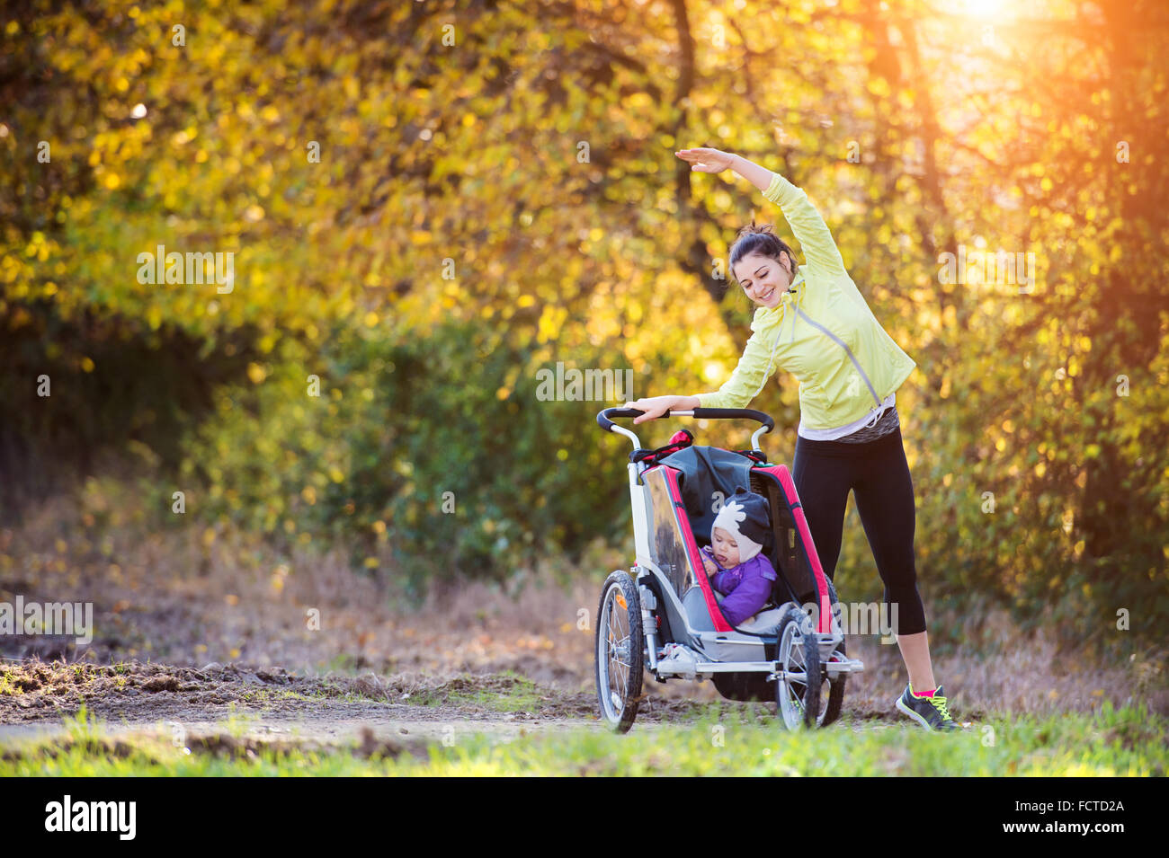 Young mother running Stock Photo - Alamy