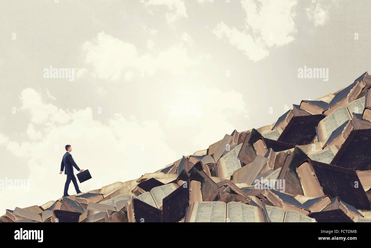 Young businessman walking up staircase representing success concept ...