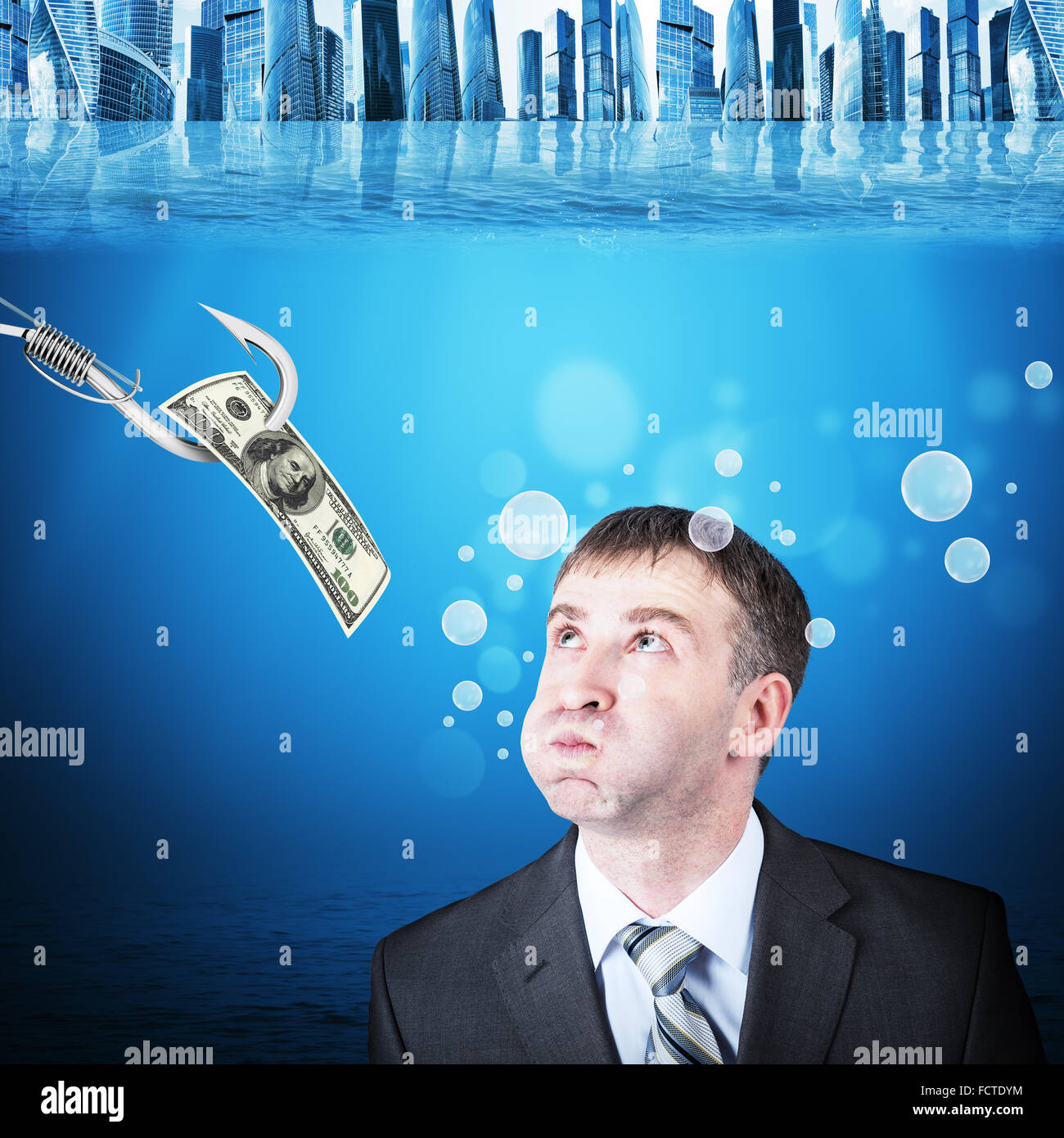 Businessman with inflated cheeks under water Stock Photo - Alamy