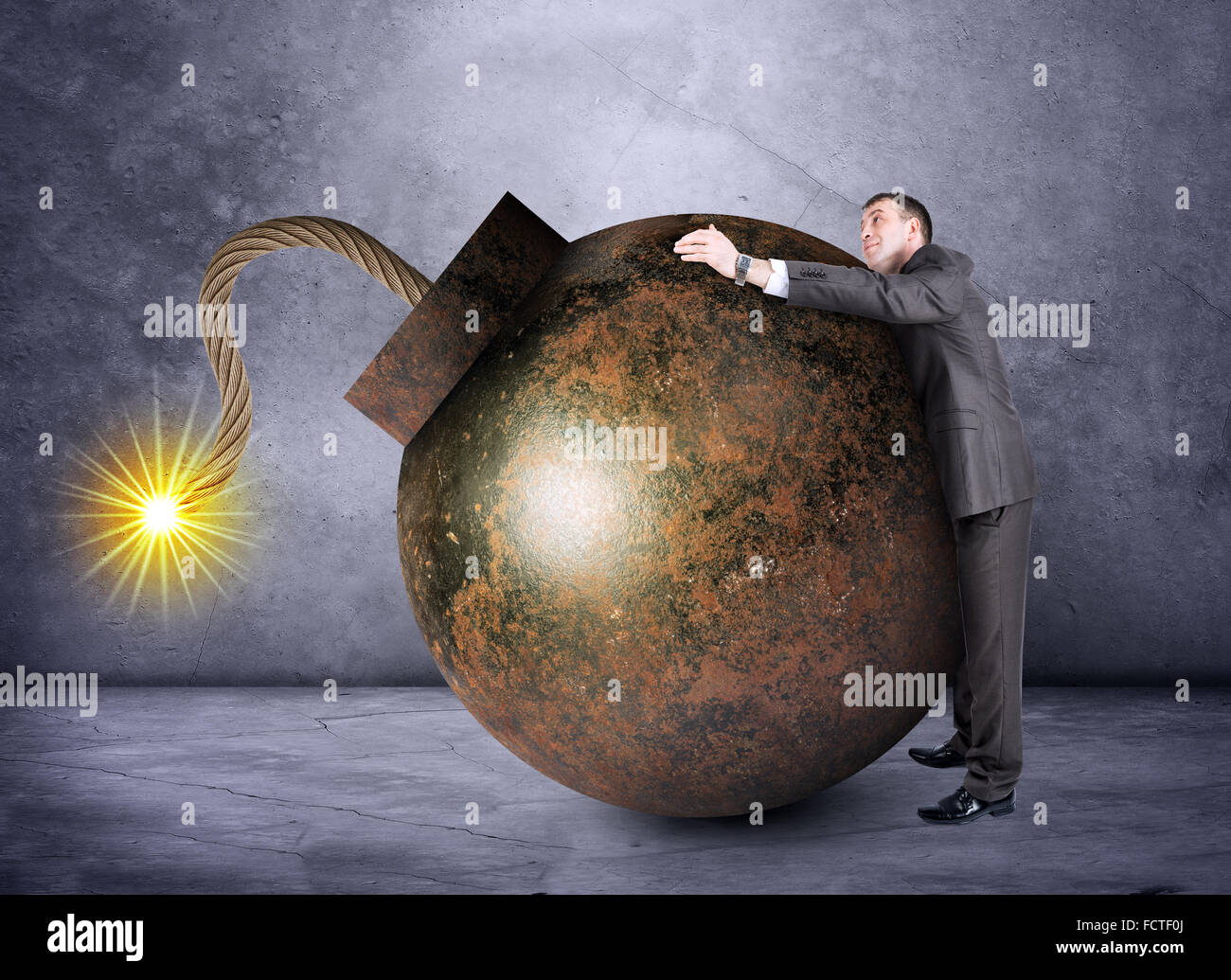 Businessman hugging bomb Stock Photo - Alamy