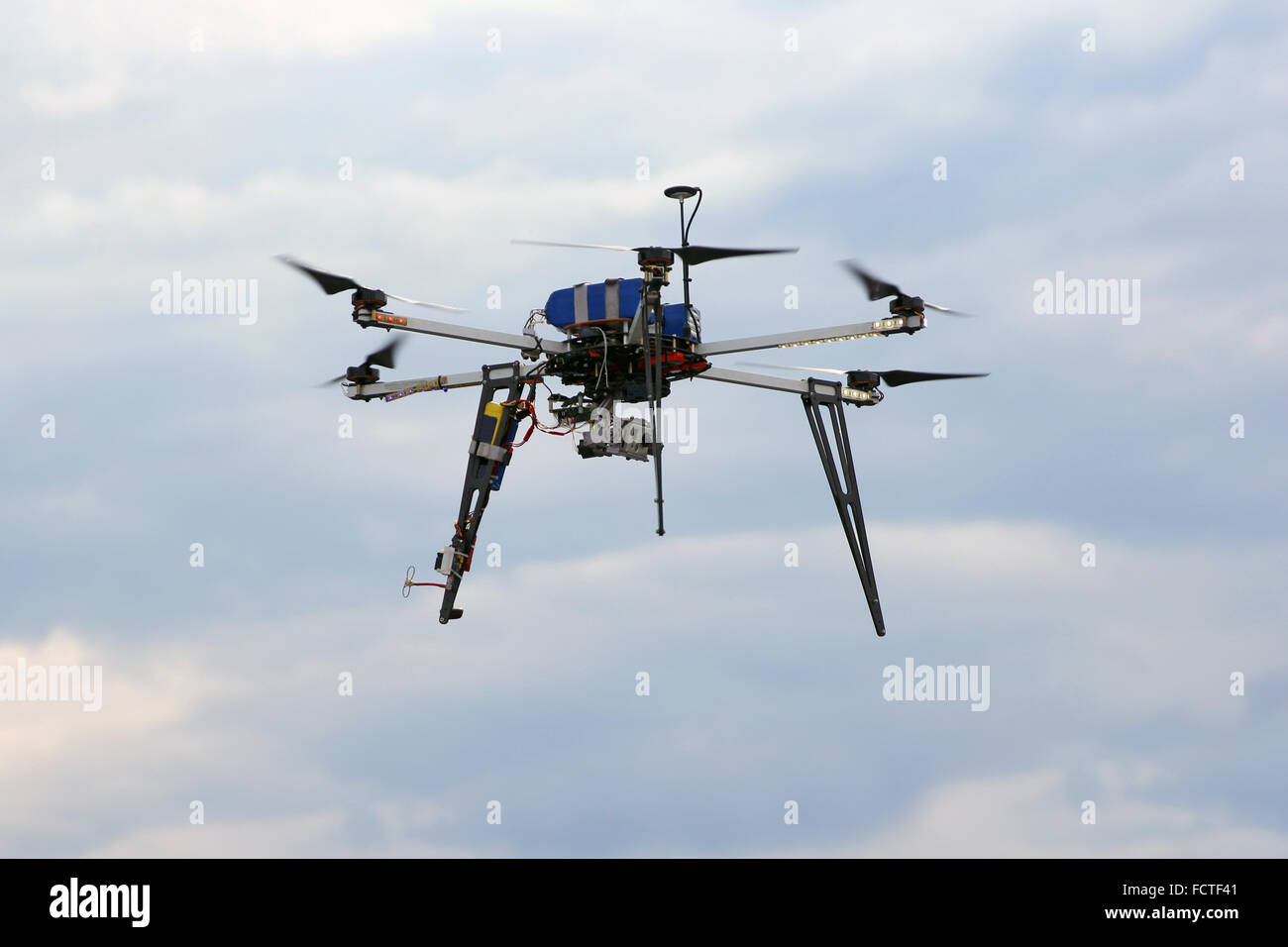 Flying drone in the sky with mounted digital camera Stock Photo - Alamy