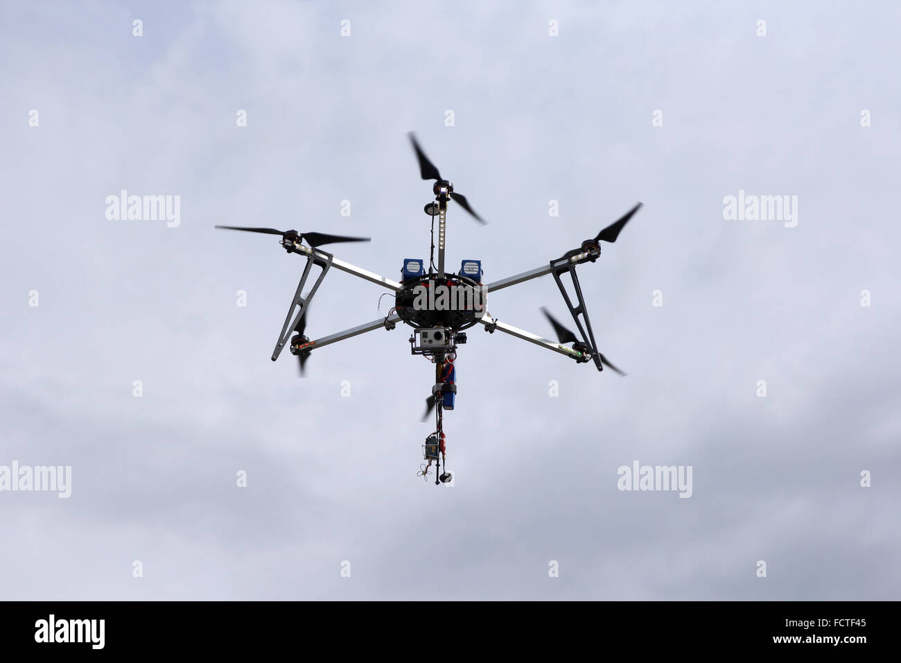 Flying drone in the sky with mounted digital camera Stock Photo - Alamy
