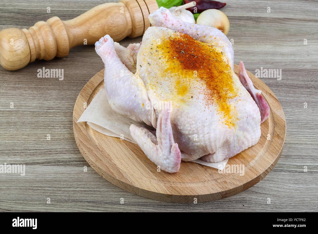 Raw chicken with spices ready for cooking Stock Photo - Alamy