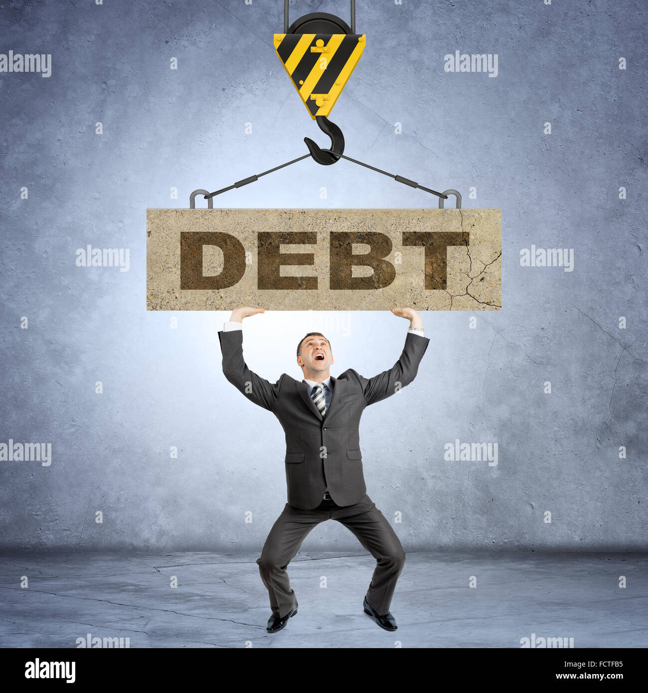 Businessman holding heavy word debt Stock Photo - Alamy