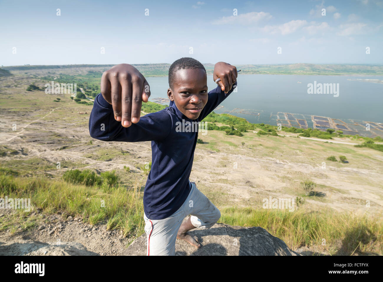 Boy and Katwe Crater Lake, Queen Elizabeth National Park, Uganda ...