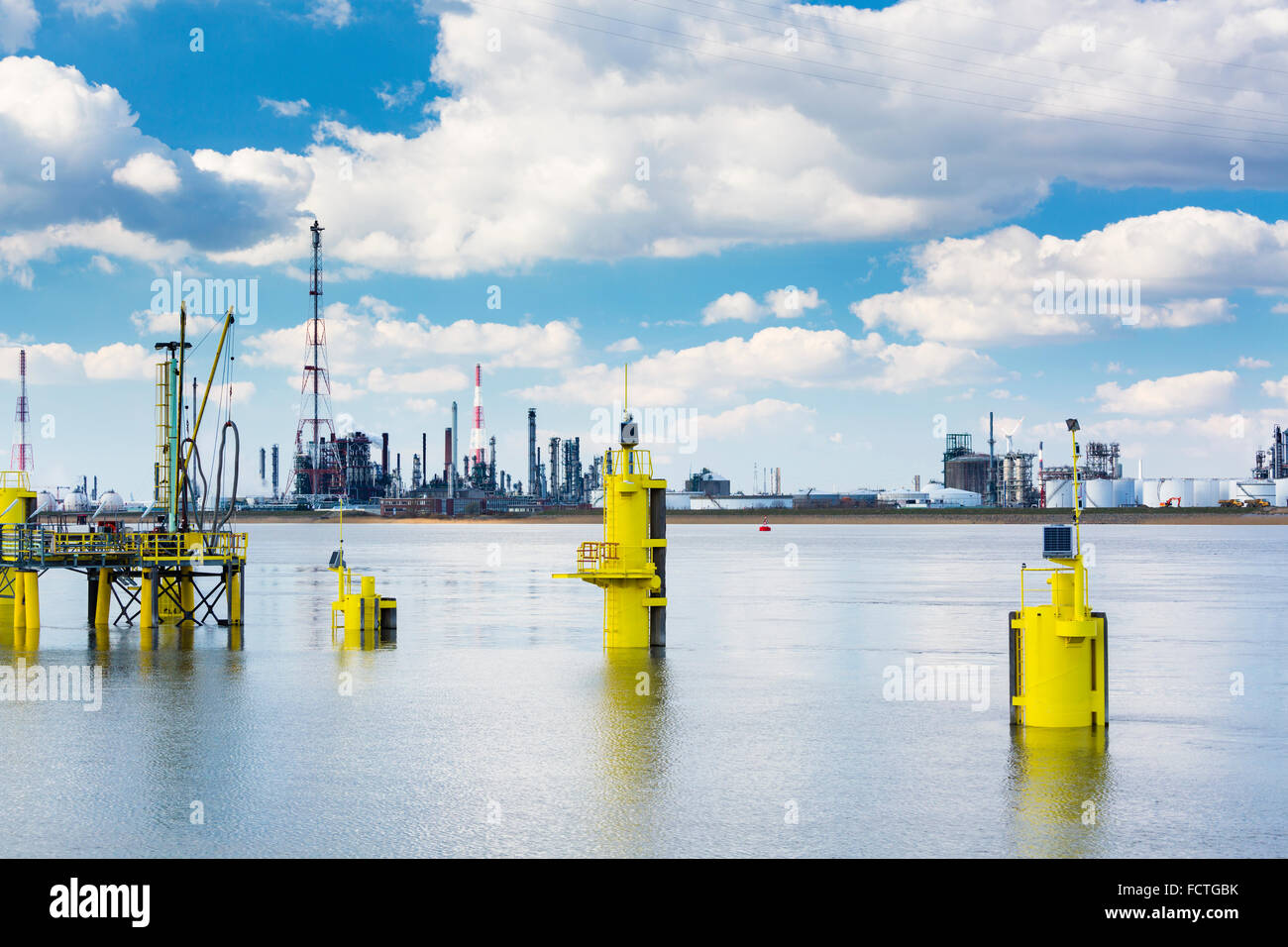 A large oil refinery with smoke stacks in the port of Antwerp, Belgium ...