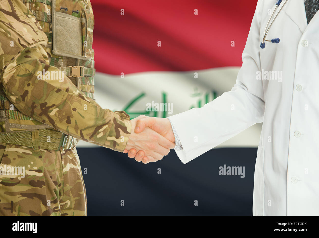 Soldier in uniform and doctor shaking hands with national flag on ...