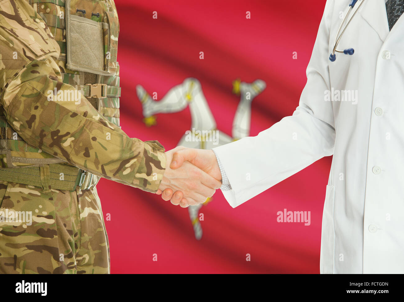 Soldier in uniform and doctor shaking hands with national flag on ...