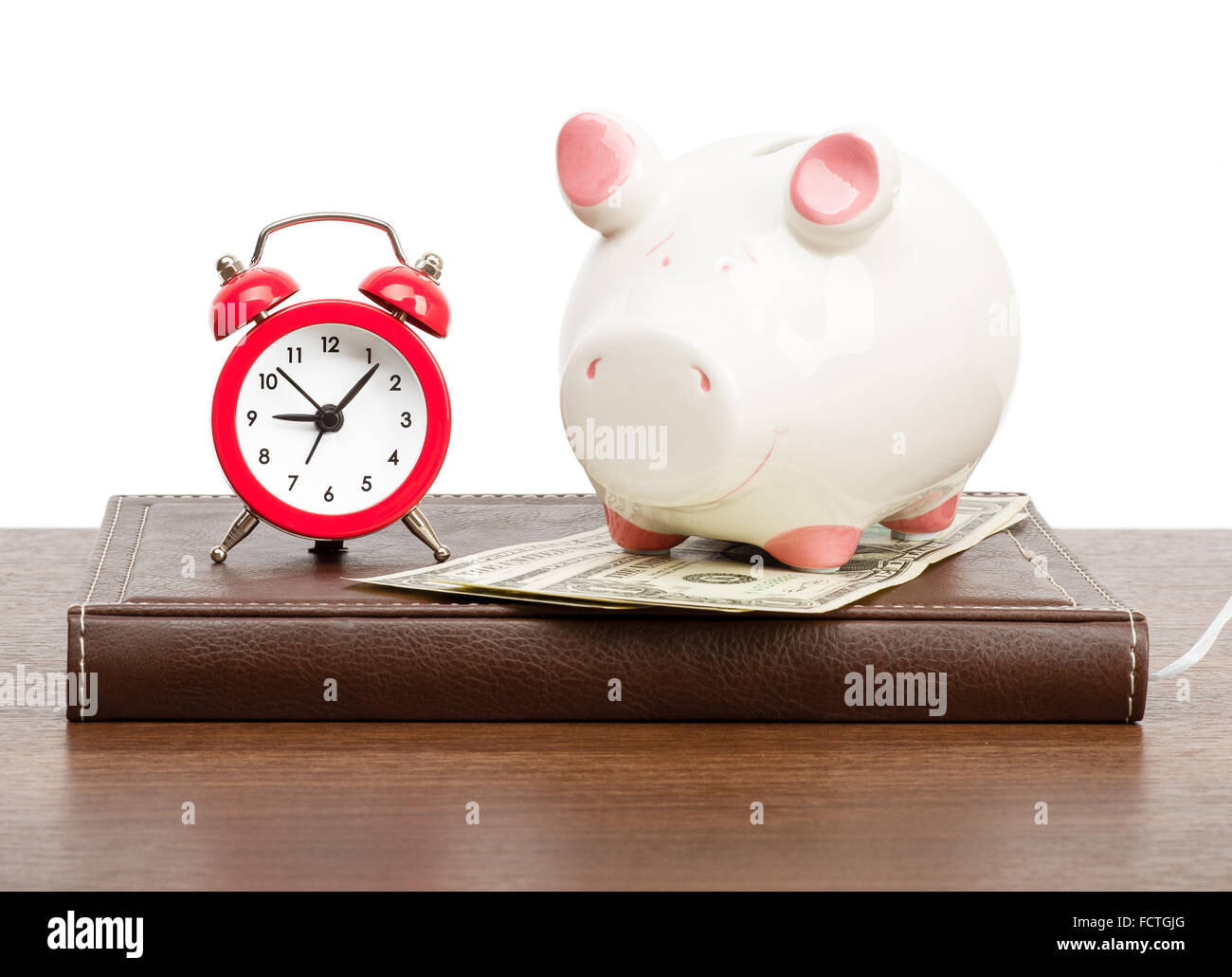 Alarm clock with piggy bank Stock Photo - Alamy