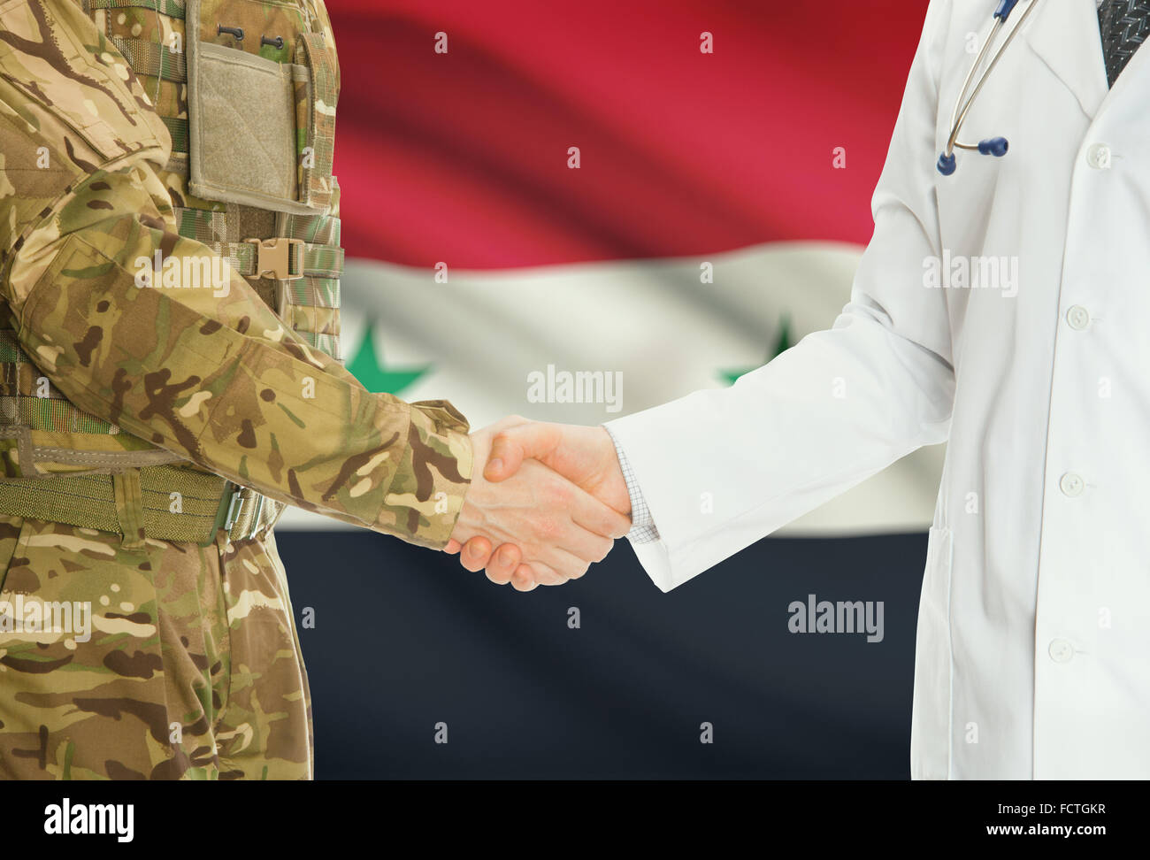 Soldier in uniform and doctor shaking hands with national flag on ...