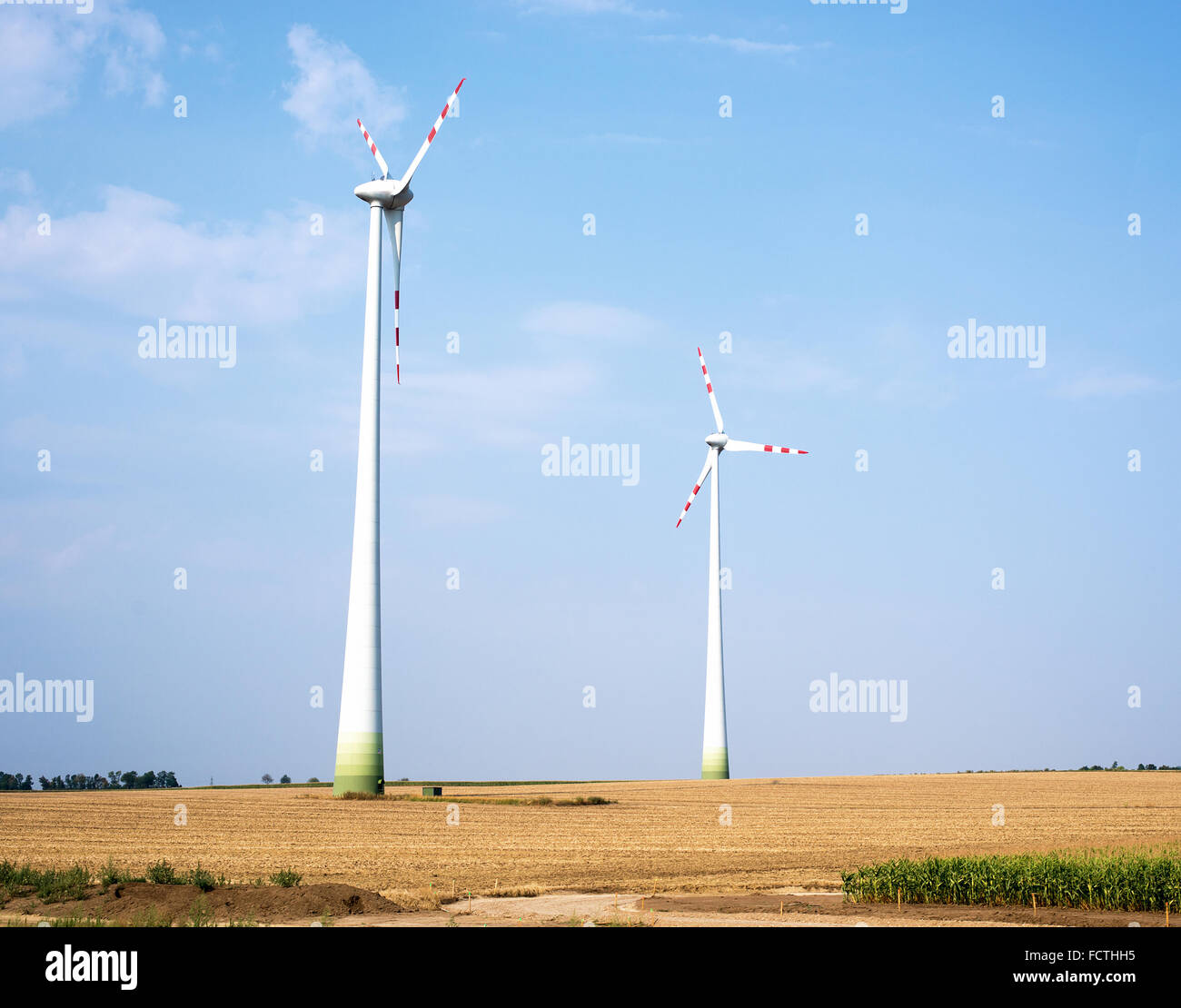 Wind farms on field Stock Photo - Alamy