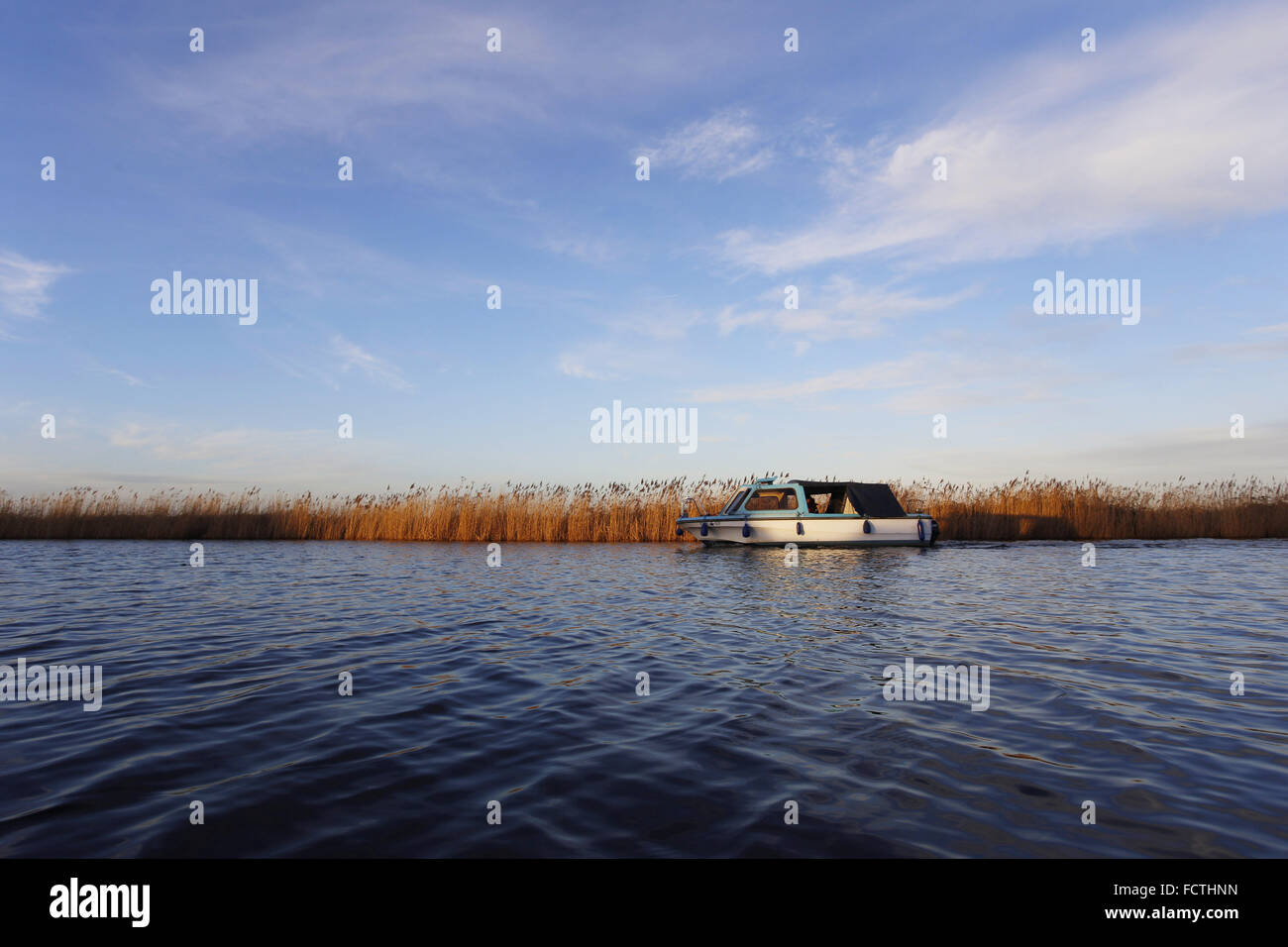 Norfolk Broads: Motor Cruiser on the River Thurne near Martham, Norfolk ...