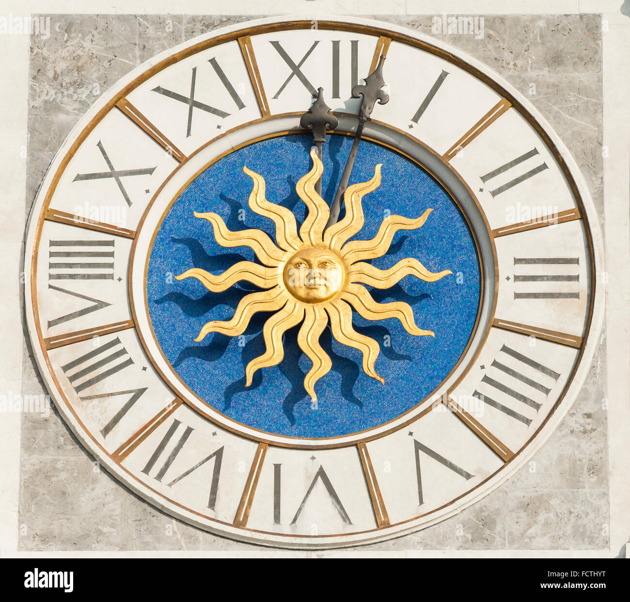 The clock face of an Italian bell tower Stock Photo - Alamy