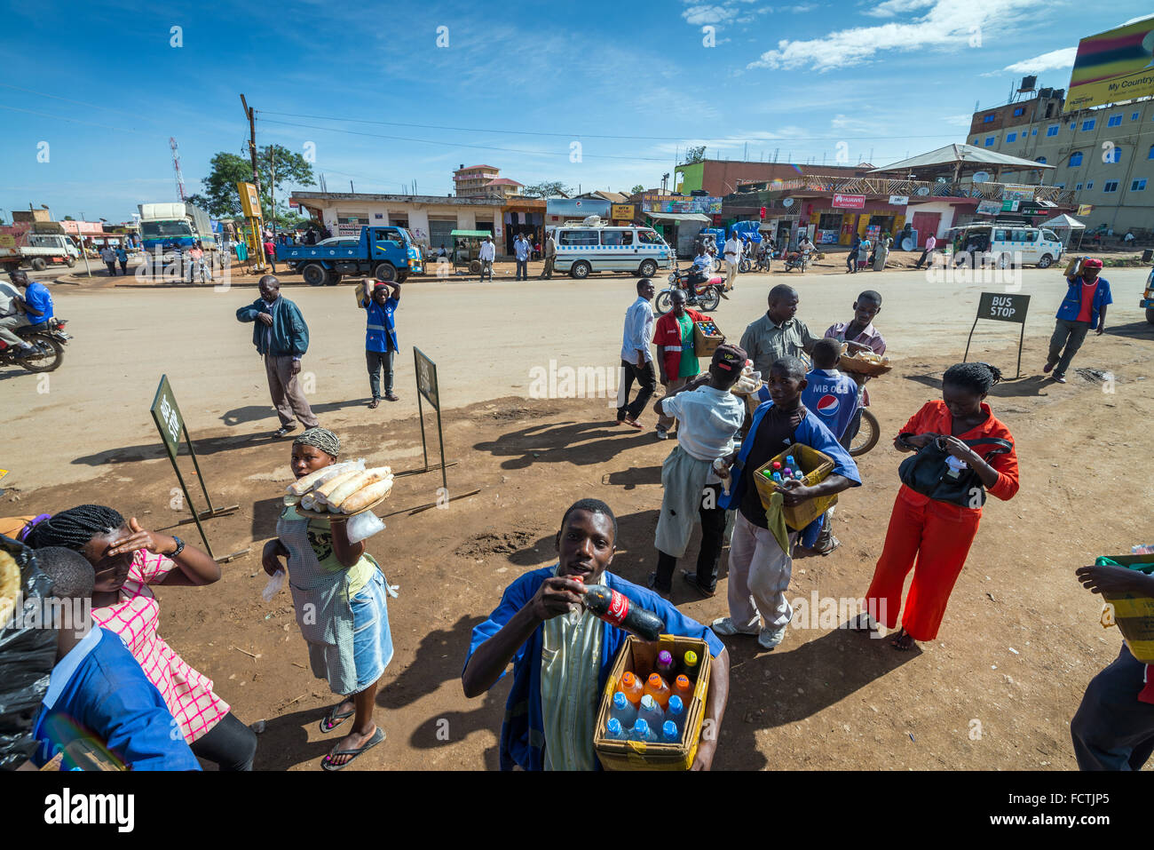Street sellers sell goods to people on local buses passing through the ...