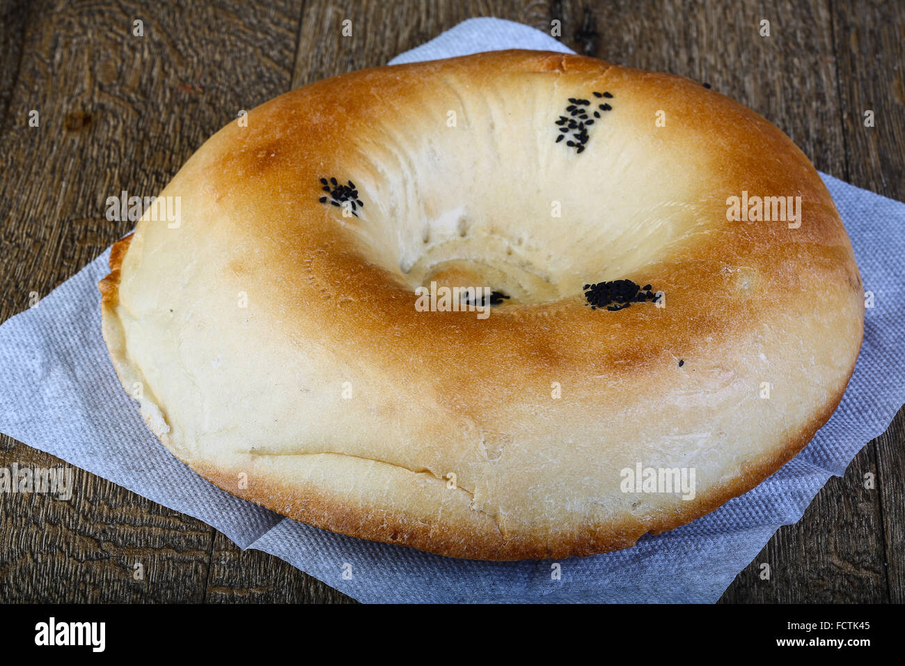 Traditional Uzbek bread on the wood background Stock Photo - Alamy
